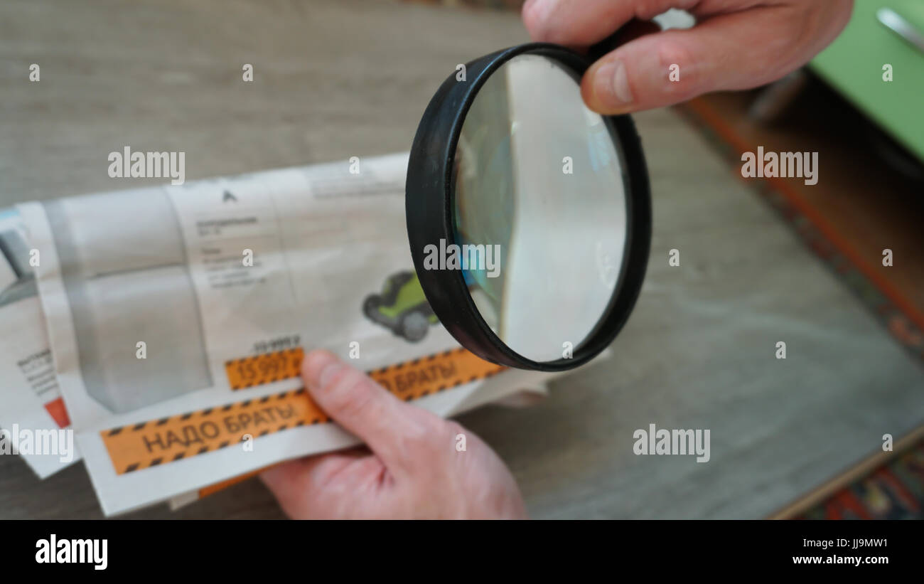 Businessman hand document and magnifier in office Stock Photo - Alamy