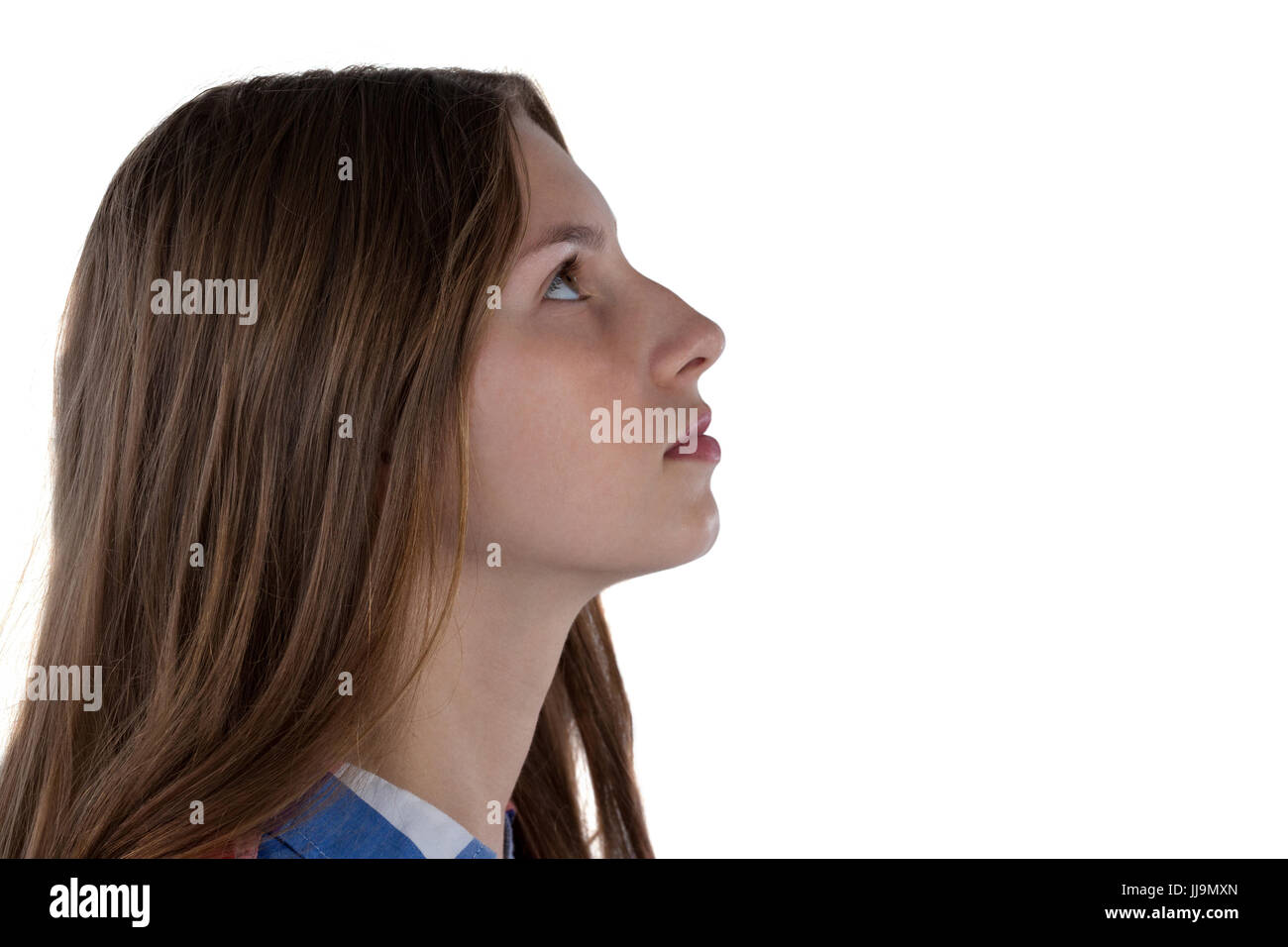 Side view of teenage girl against white background Stock Photo - Alamy