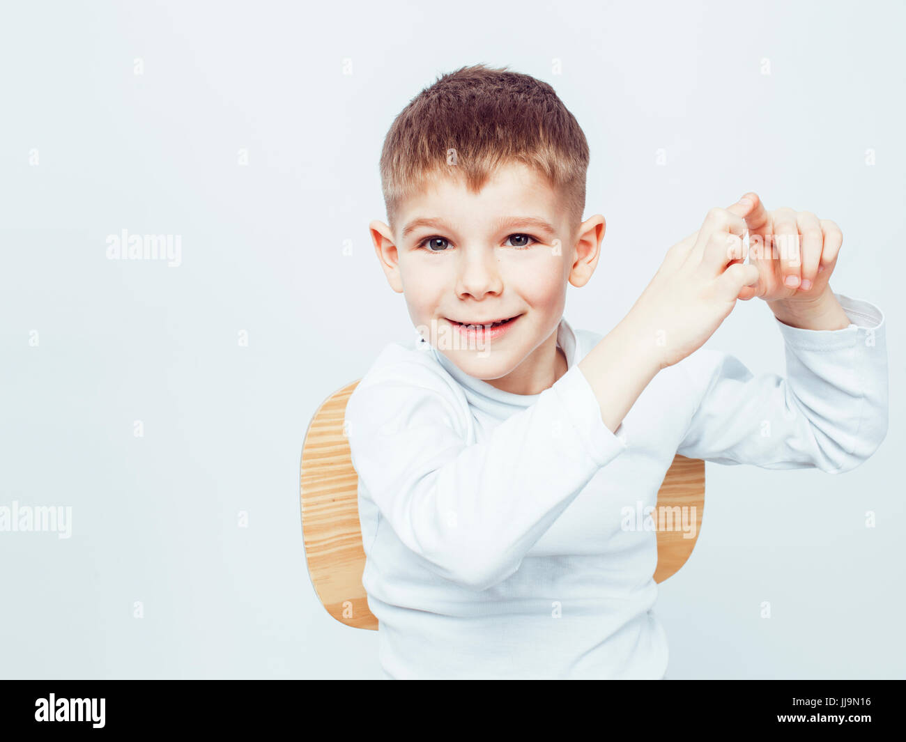 young pretty little cute boy kid wondering, posing emotional face ...