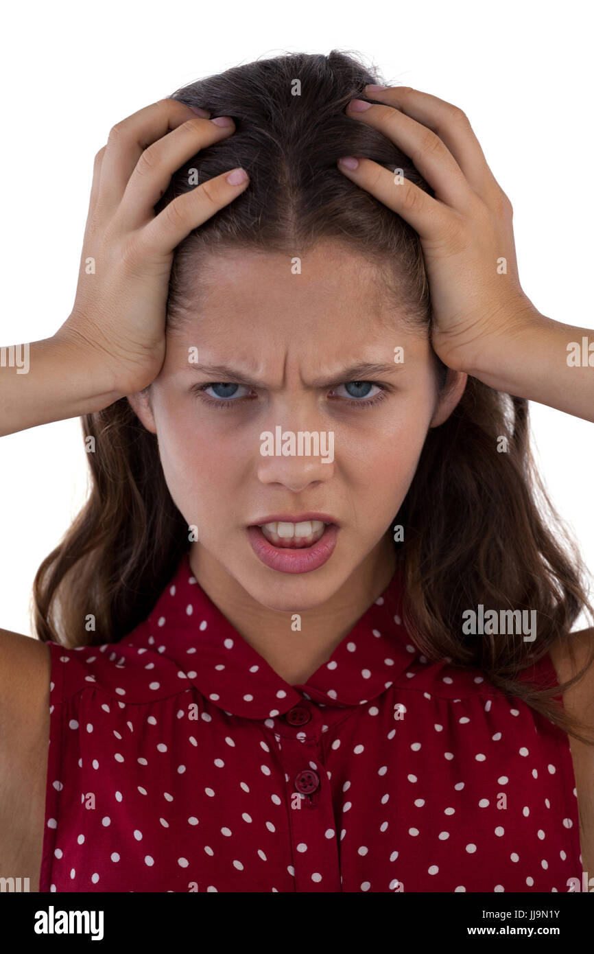Confused teenage girl standing against white background Stock Photo - Alamy