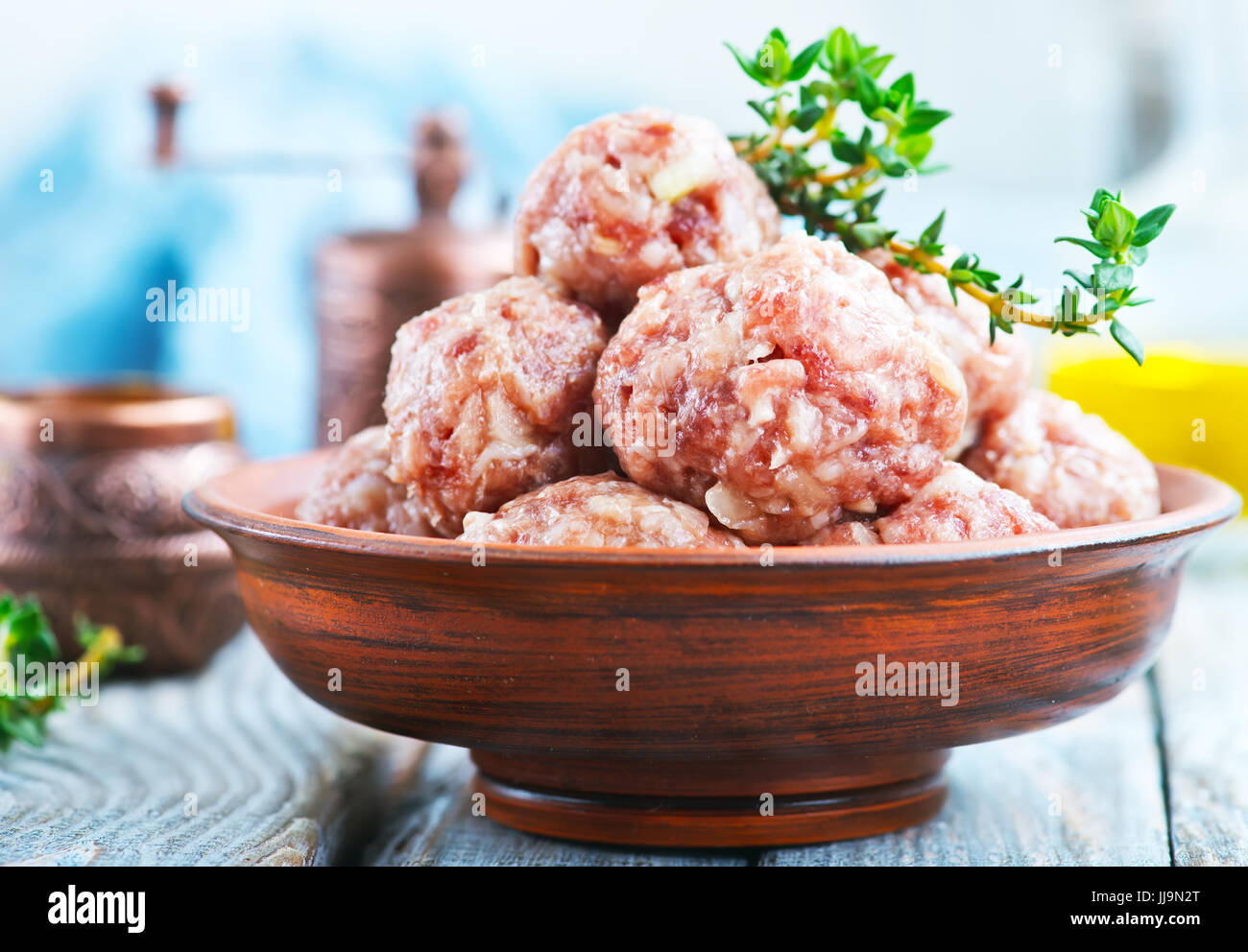 raw meatballs with spice and salt on a table Stock Photo - Alamy
