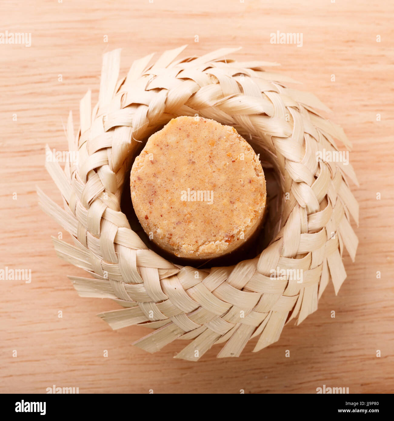Pacoca - brazilian candy of ground peanut in wicker hat of Festa Junina ...