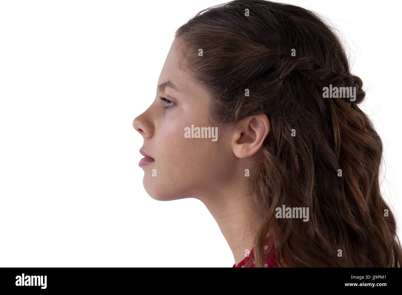 Side view of teenage girl against white background Stock Photo - Alamy