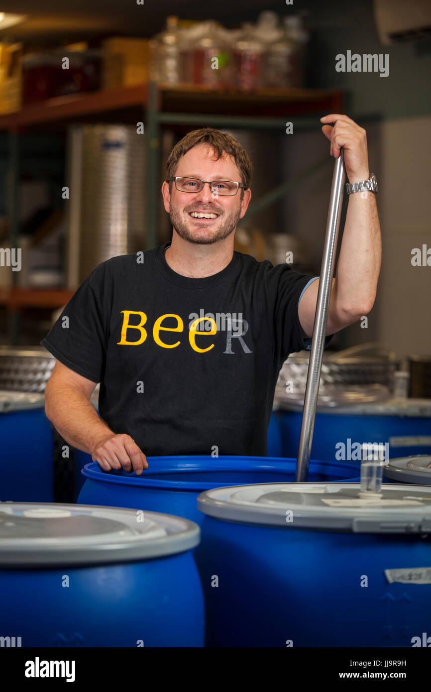 A portrait of a mead maker among barrels of mead Stock Photo - Alamy