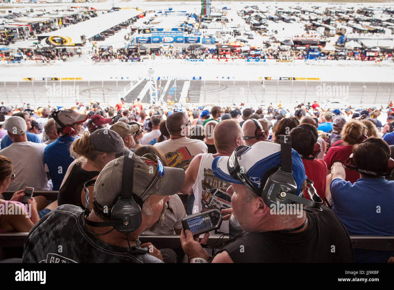 Two men watching and discussing the race from the stands, New Hampshire ...