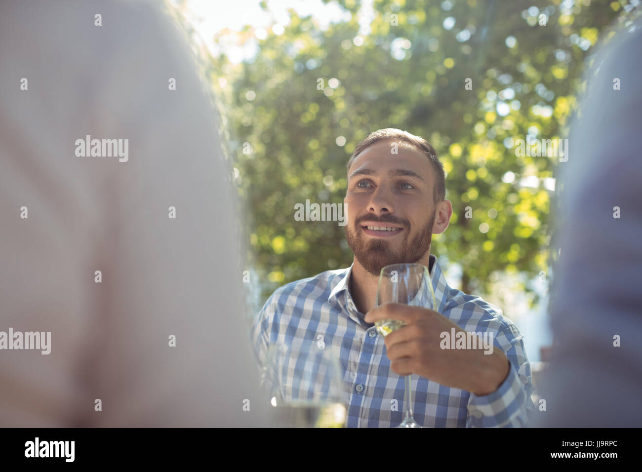 Smiling man having breakfast at outdoor restaurant Stock Photo - Alamy