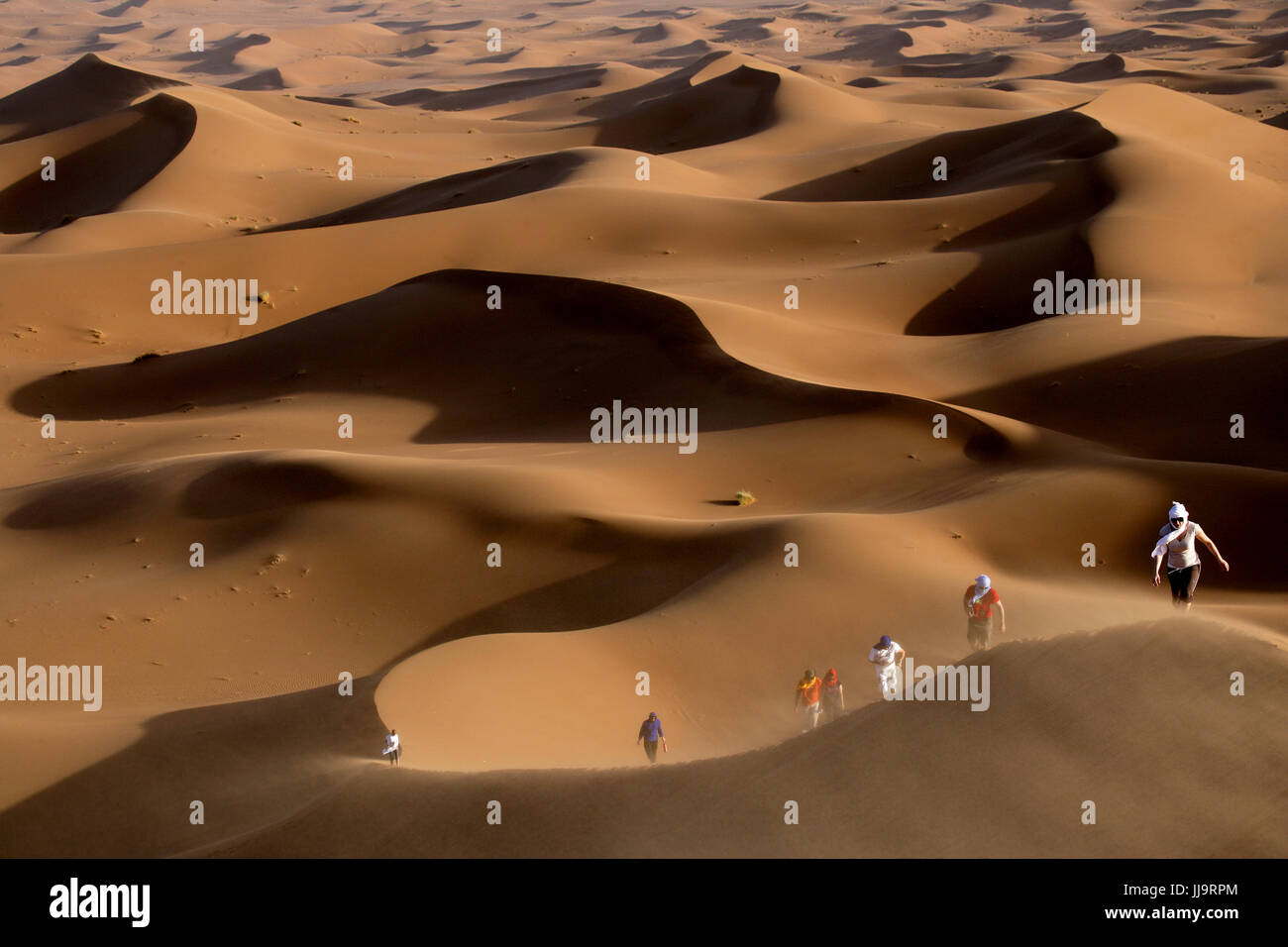 People exploring Erg Chebbi dunes, Morocco, North Africa Stock Photo ...