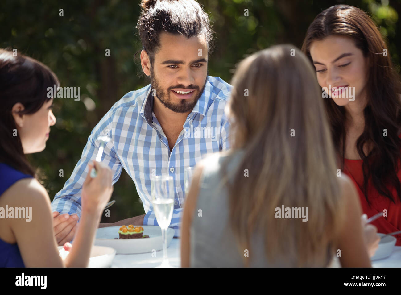 Group of friends having lunch in a restaurant Stock Photo - Alamy