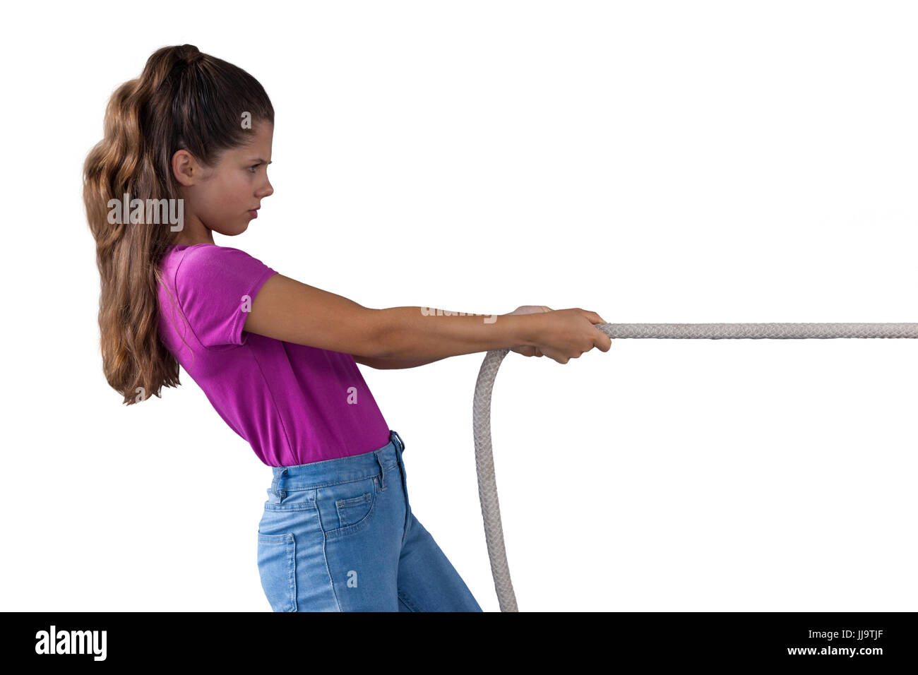 Girl pulling the rope against white background Stock Photo - Alamy