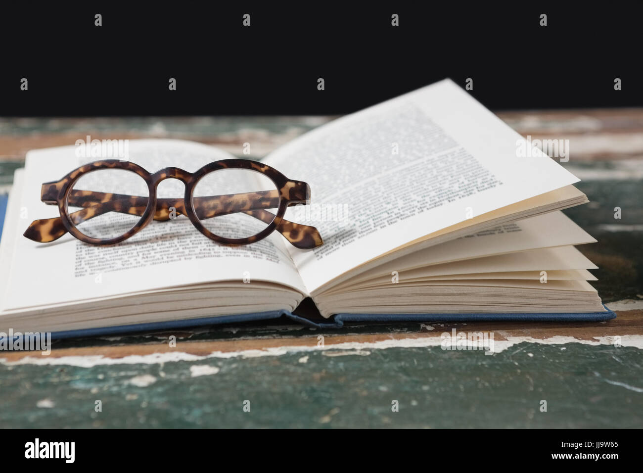 Open book on table spectacles hi-res stock photography and images - Alamy