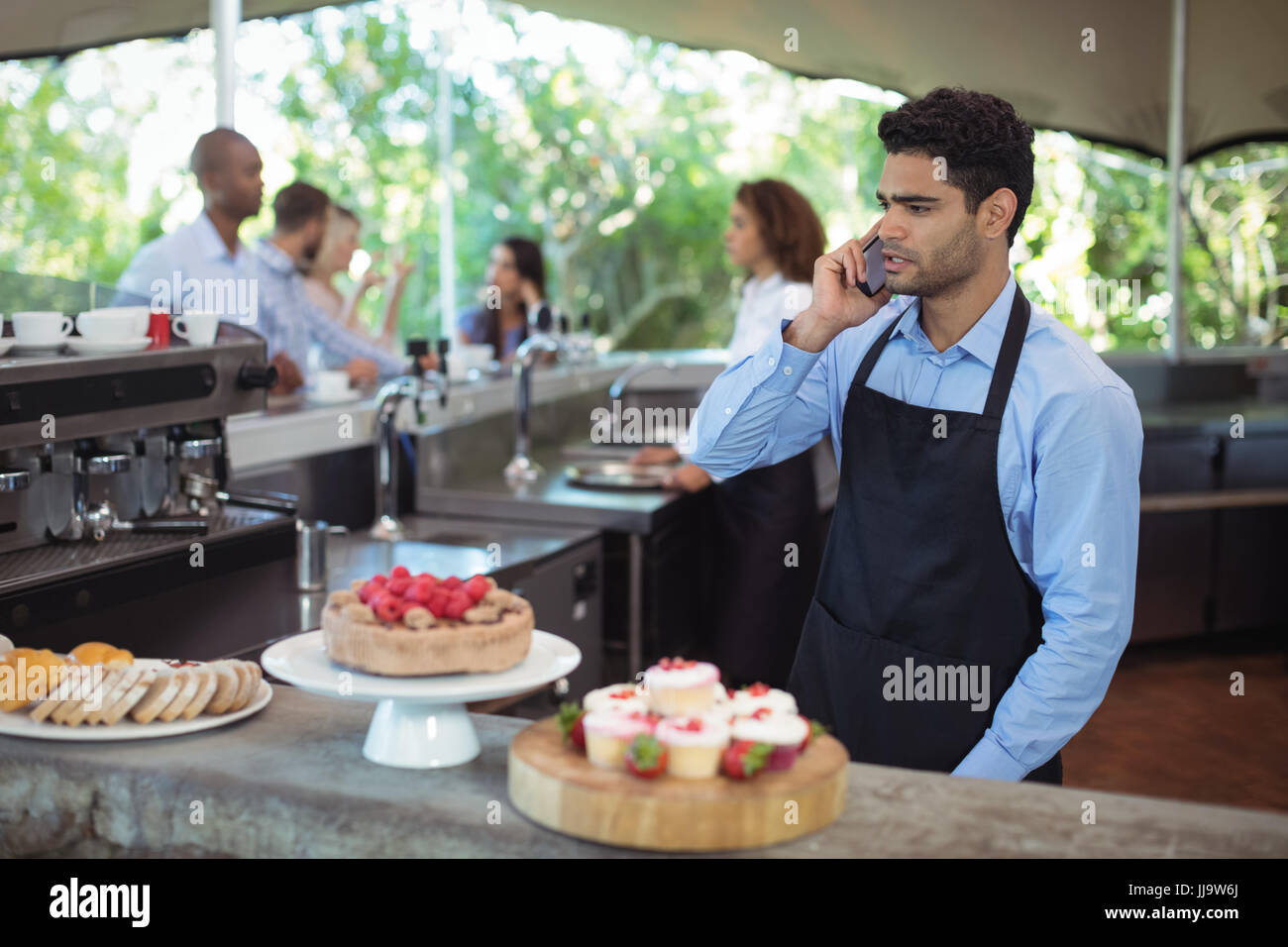 Restaurant customer calling waiter hi-res stock photography and images ...