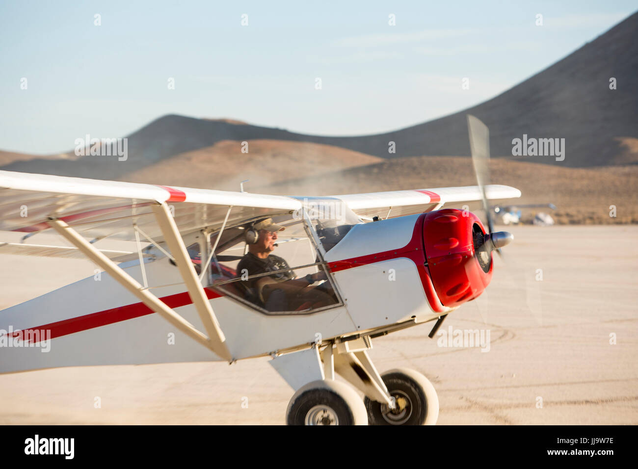 A Pilot is visible in the cockpit of his prop plane Stock Photo - Alamy