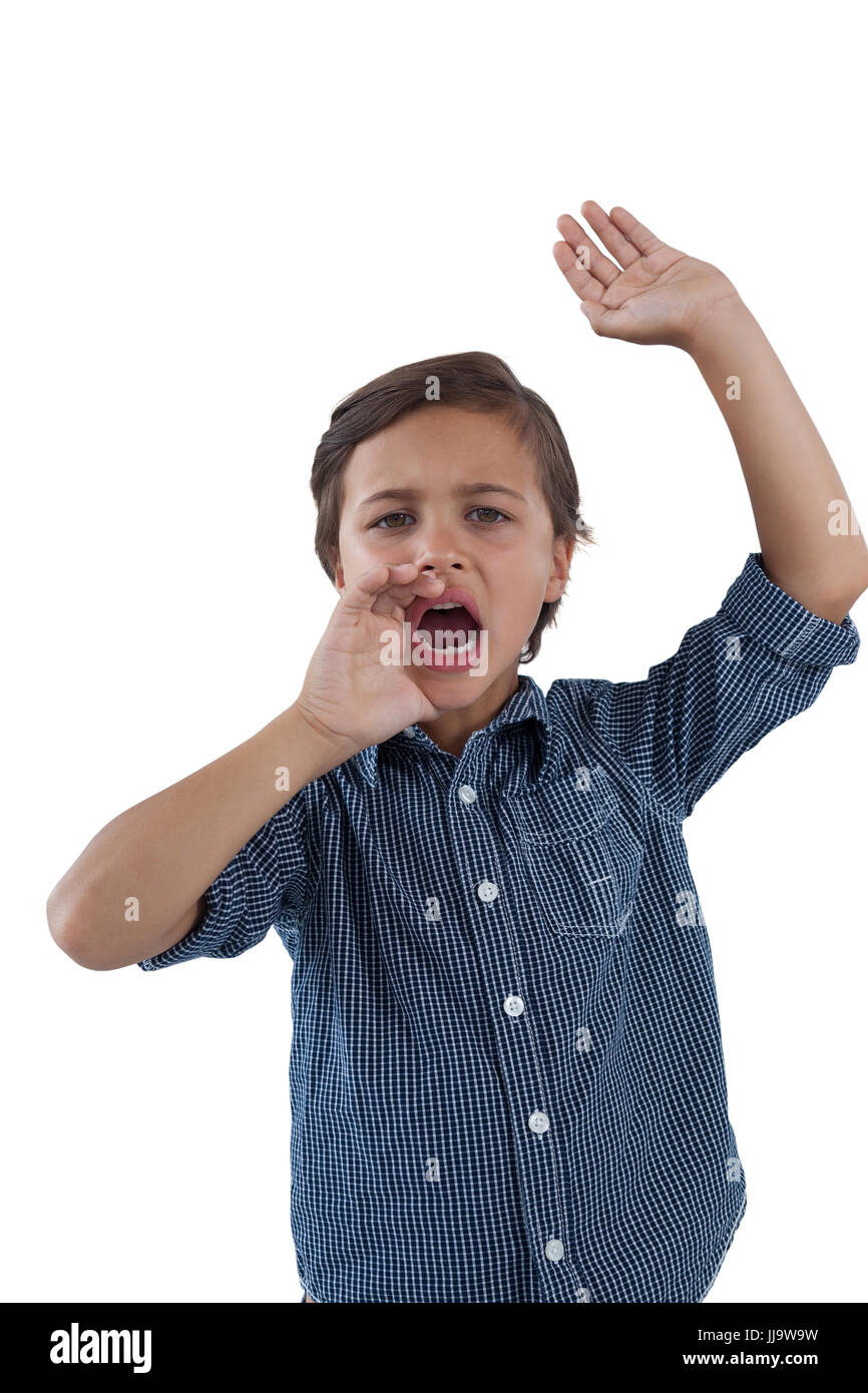 Cute boy shouting against white background Stock Photo - Alamy