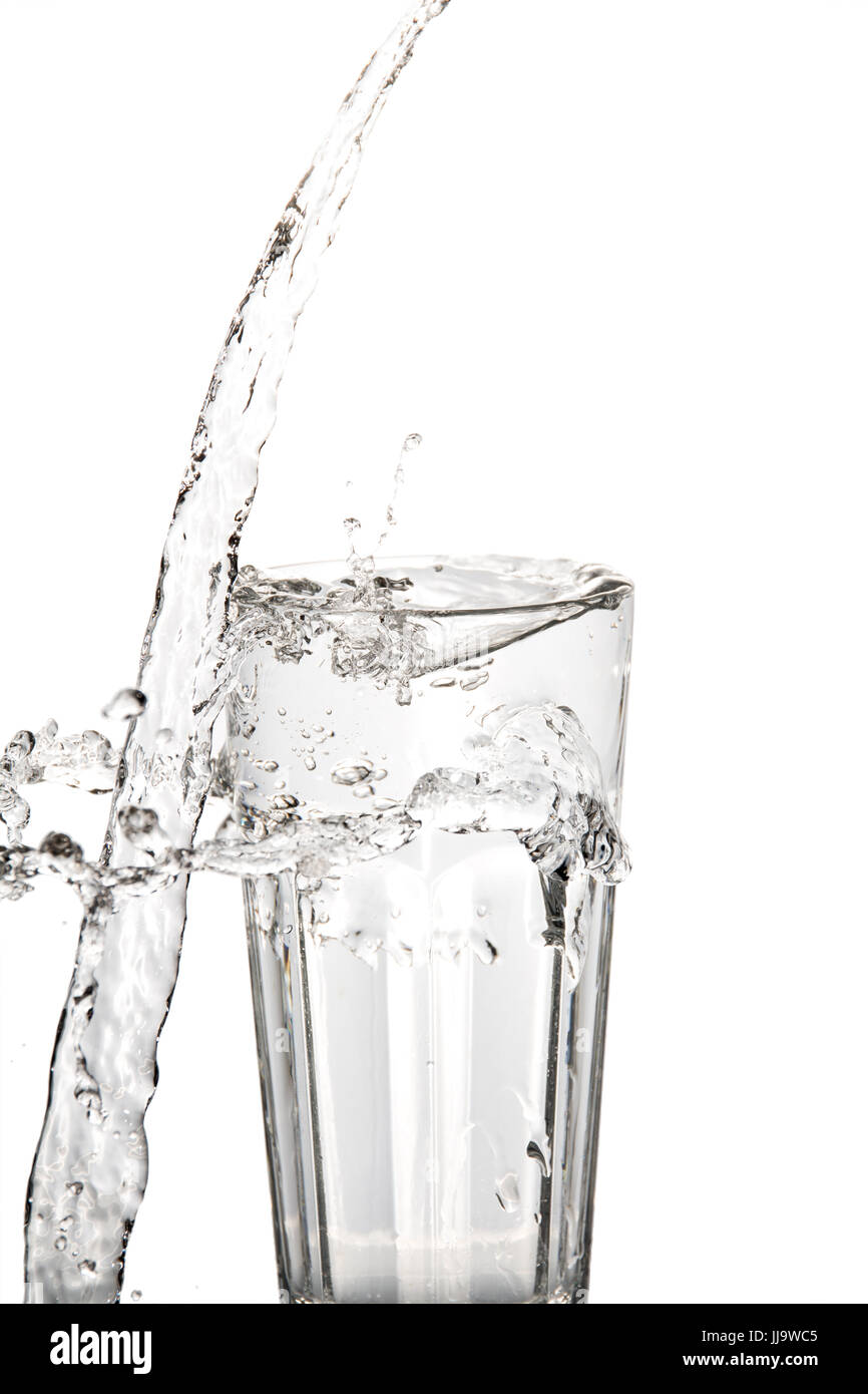 glass water with water being dropped in the glass, water in movement ...