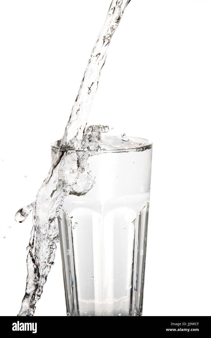 glass water with water being dropped in the glass, water in movement ...