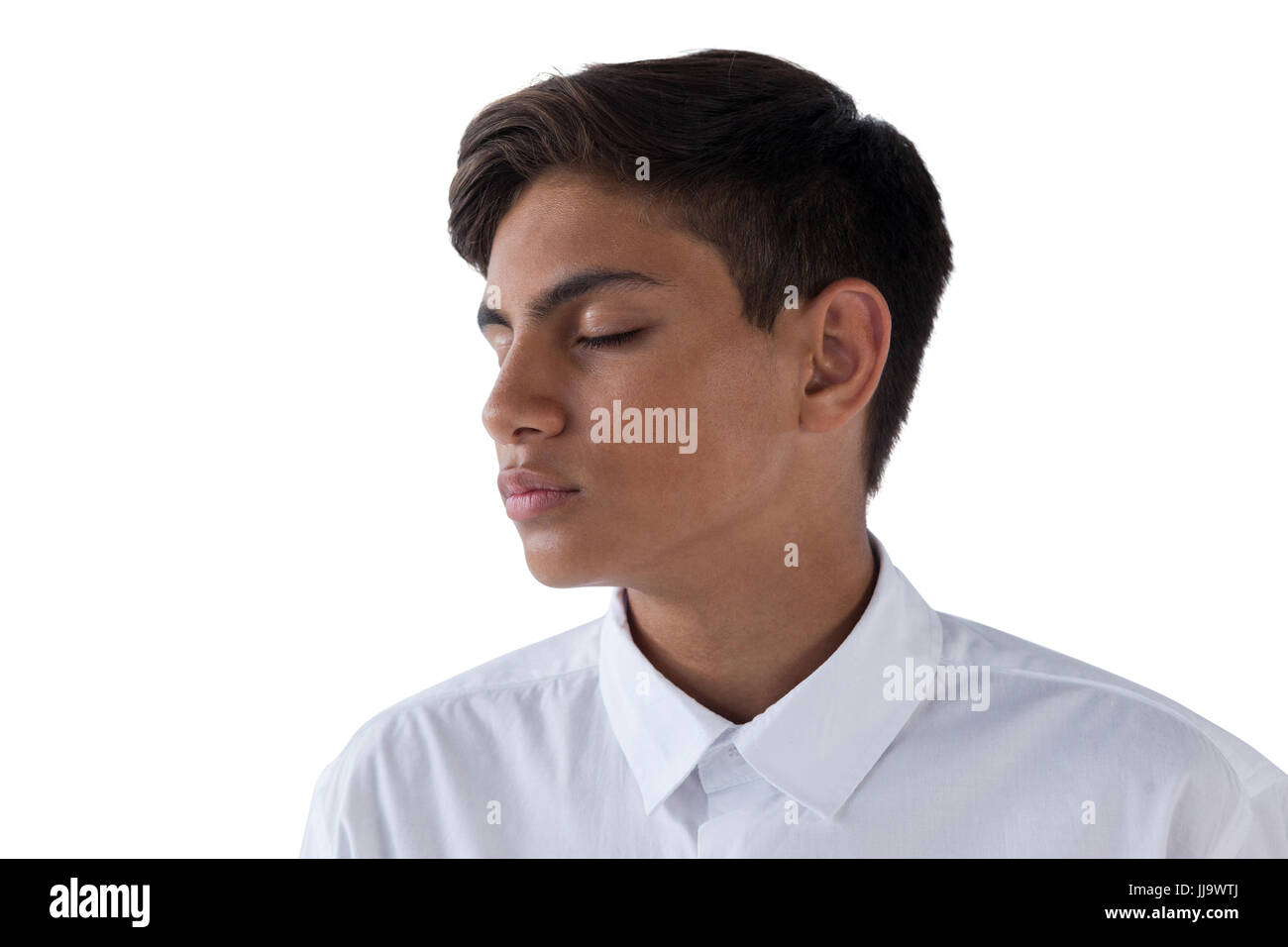 Side view of teenage boy against white background Stock Photo - Alamy