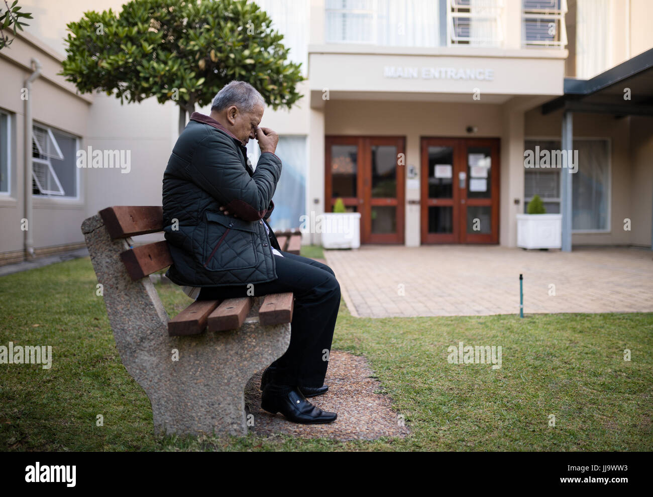 Person Sitting On A Bench Side View