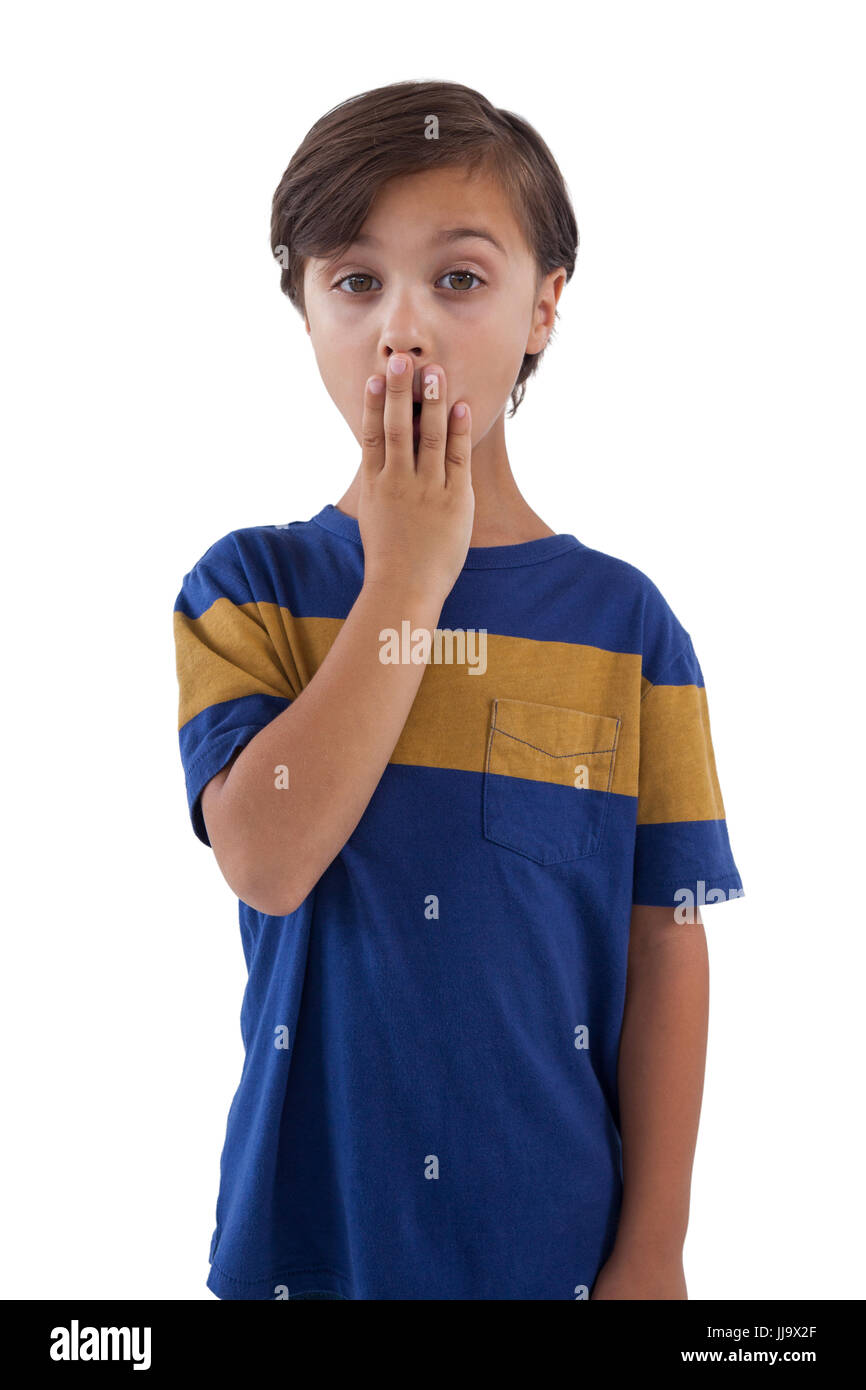 Portrait of shocked boy standing against white background Stock Photo ...