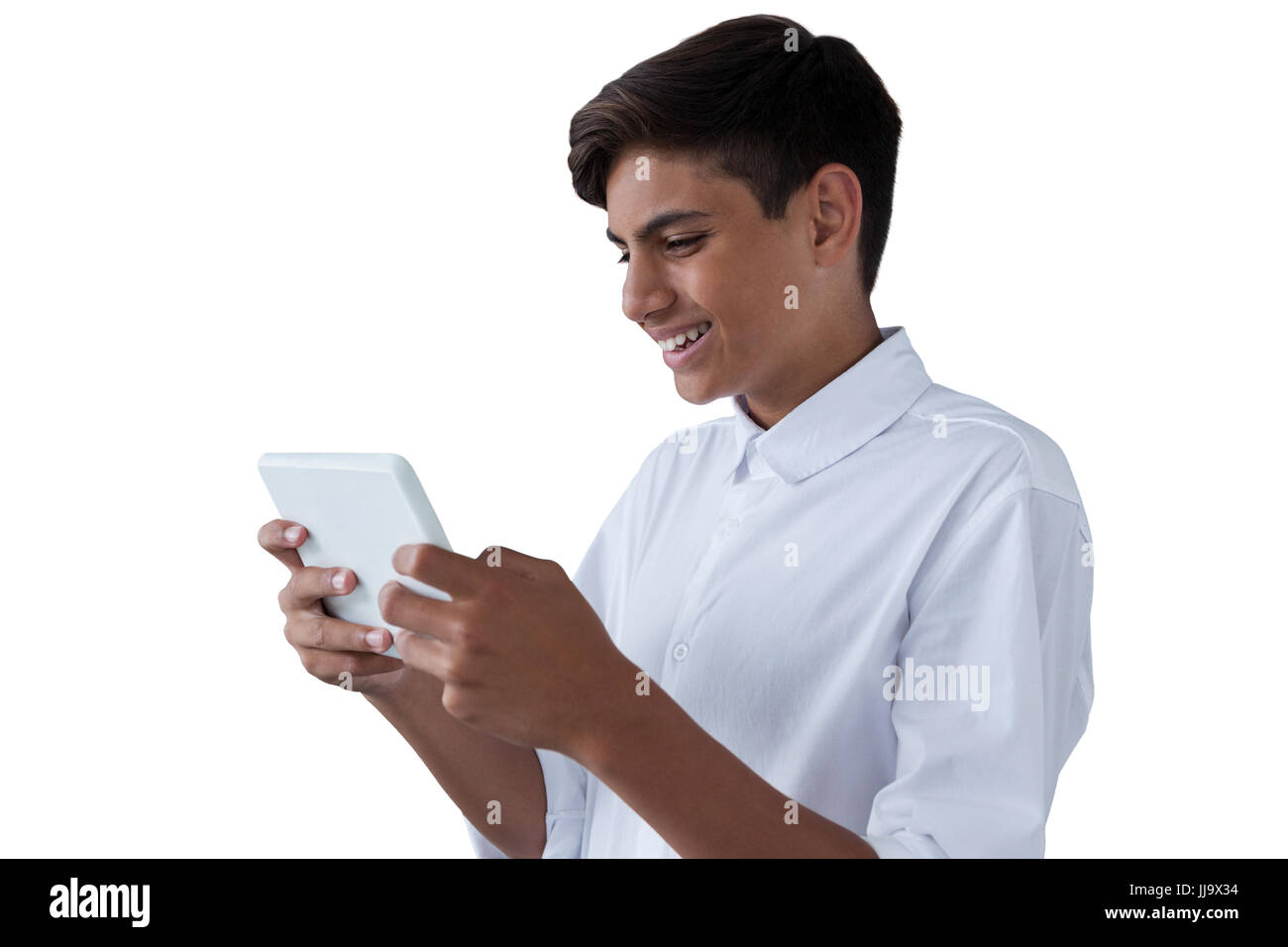 Boy using digital tablet against white background Stock Photo - Alamy