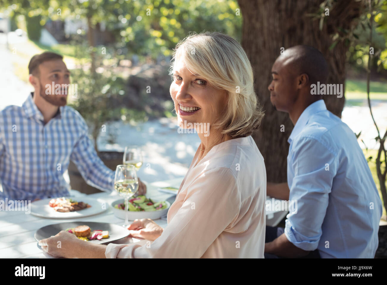 Group of friends having lunch in a restaurant Stock Photo - Alamy