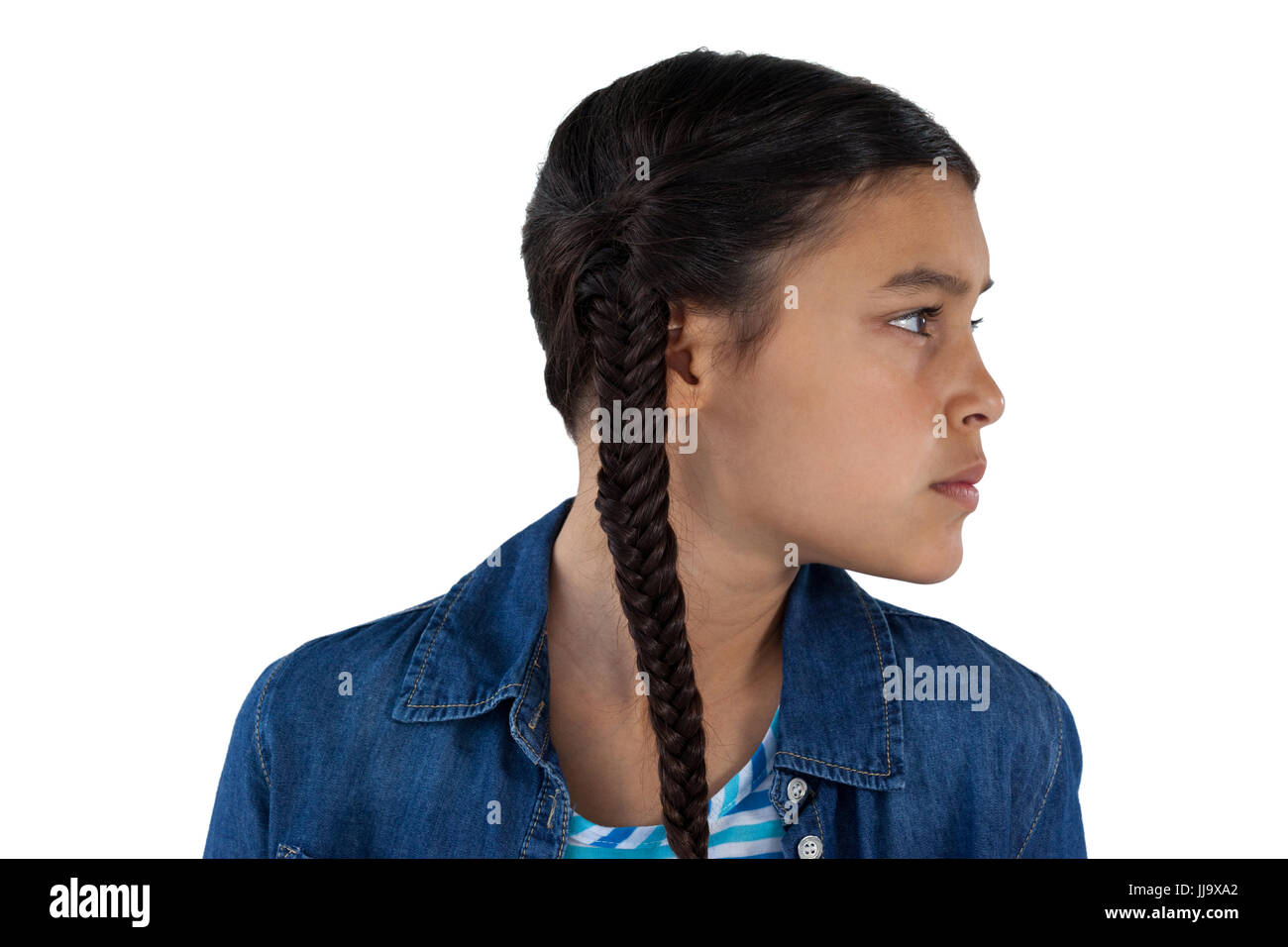 Side view of thoughtful girl standing against white background Stock ...