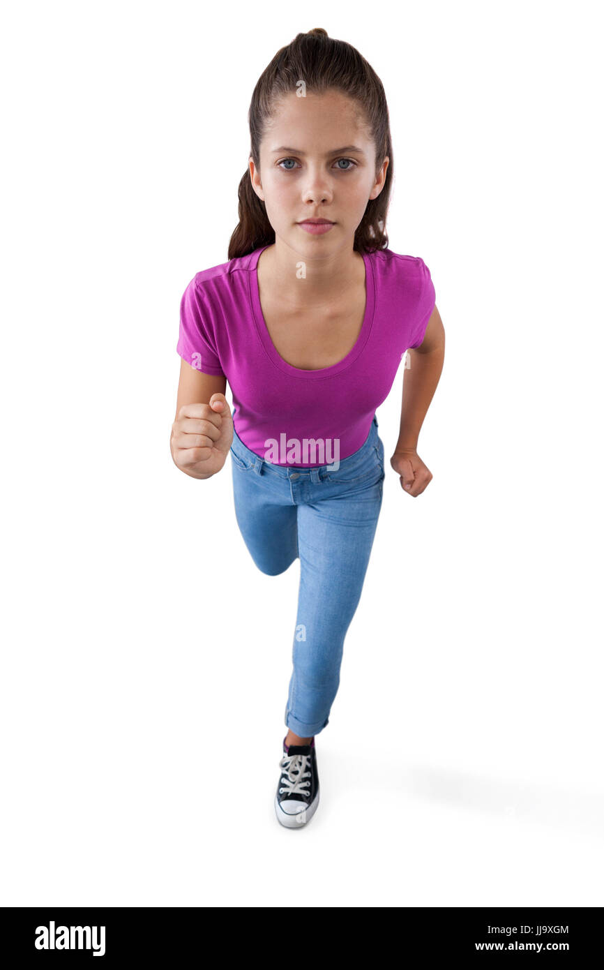 Portrait of girl running against white background Stock Photo - Alamy