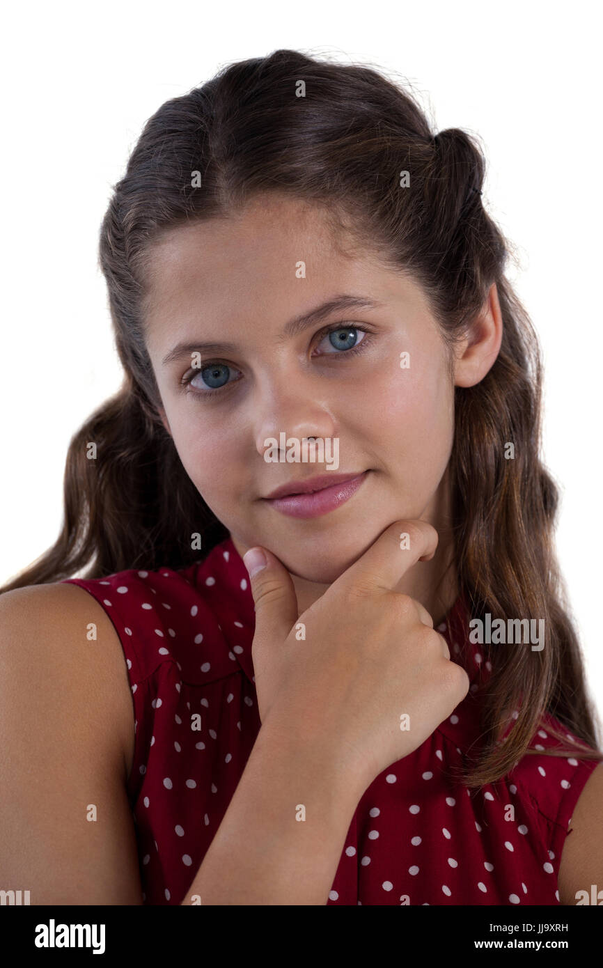 Thoughtful teenage girl against white background Stock Photo - Alamy