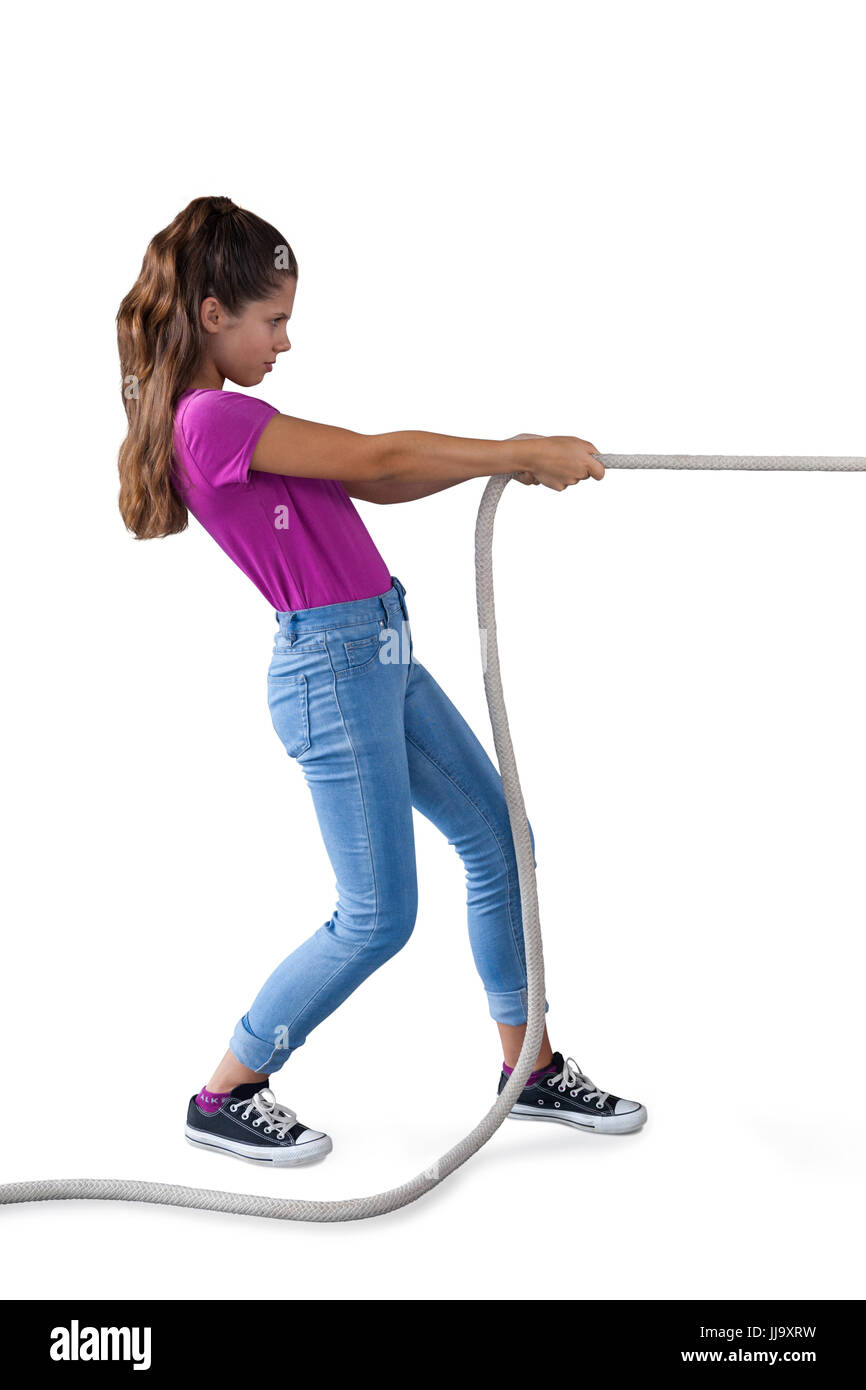 Girl pulling the rope against white background Stock Photo - Alamy