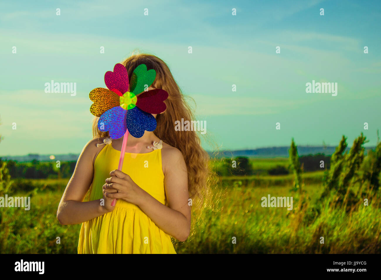 Girl with a pinwheel hi-res stock photography and images - Alamy