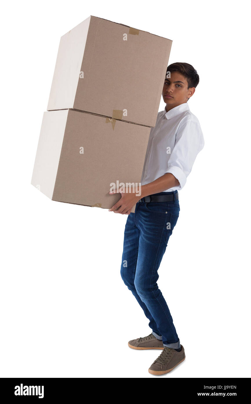 Boy carrying heavy boxes against white background Stock Photo - Alamy