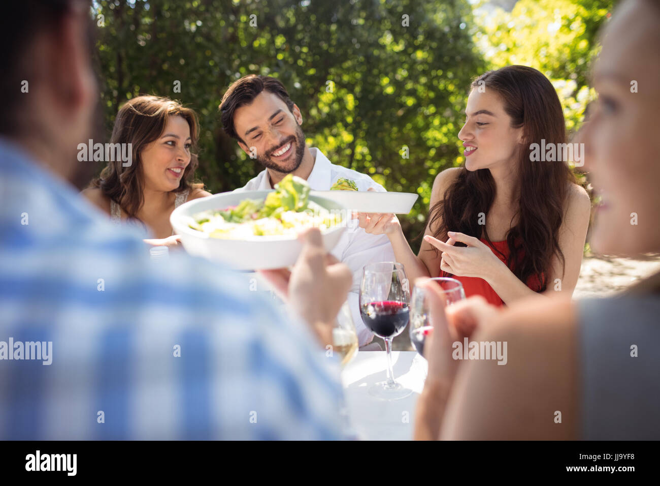 Group of friends having lunch in a restaurant Stock Photo - Alamy