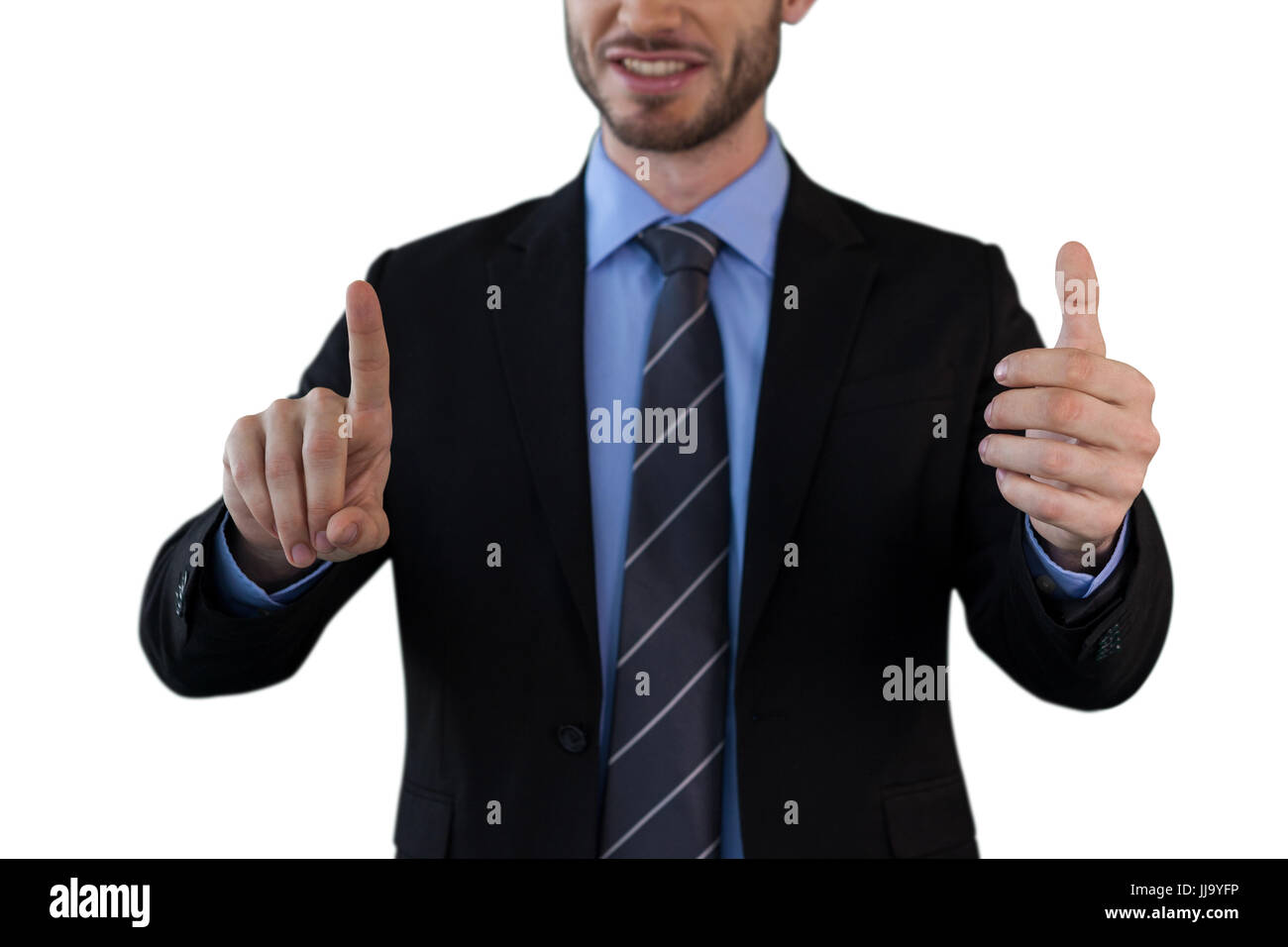 Mid section of businessman wearing suit while using invisible interface ...