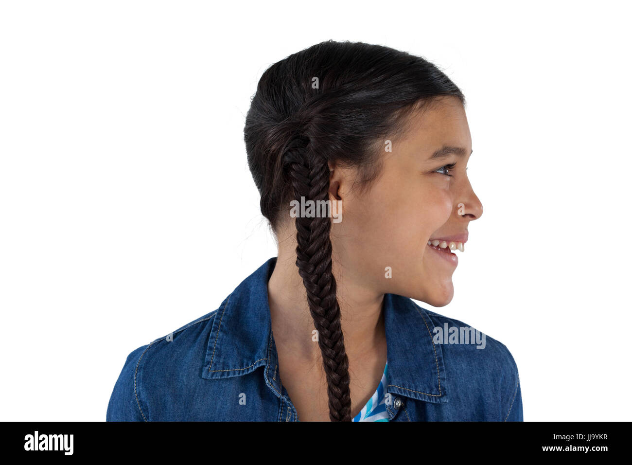 Side view of smiling cute girl standing against white background Stock ...