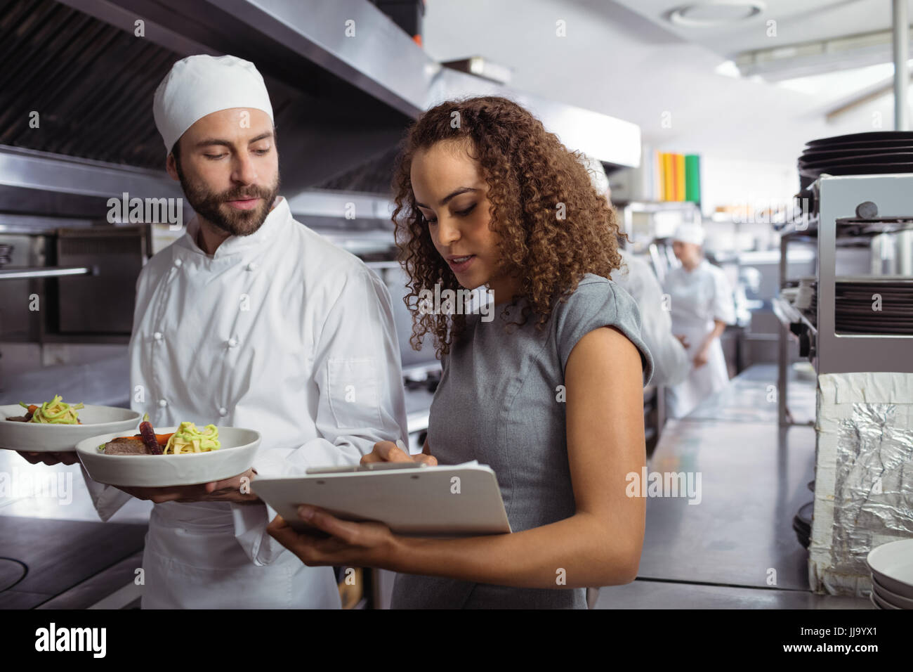 Handsome Chef Showing Menu High Resolution Stock Photography and Images ...