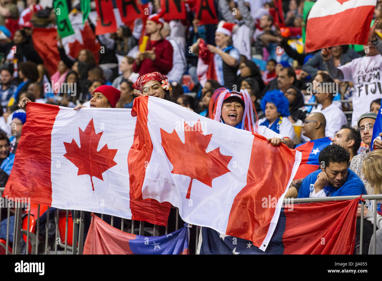 Fans holding up Canadian Flags during a sporting event held at BC Place ...
