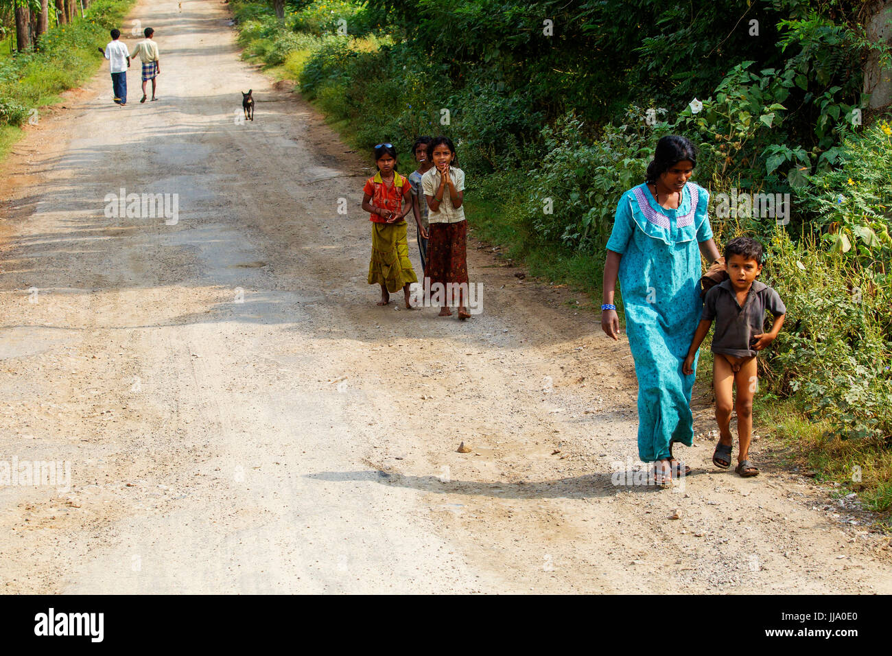 Indian people at the road near Nagarahole Park, Karapura village ...