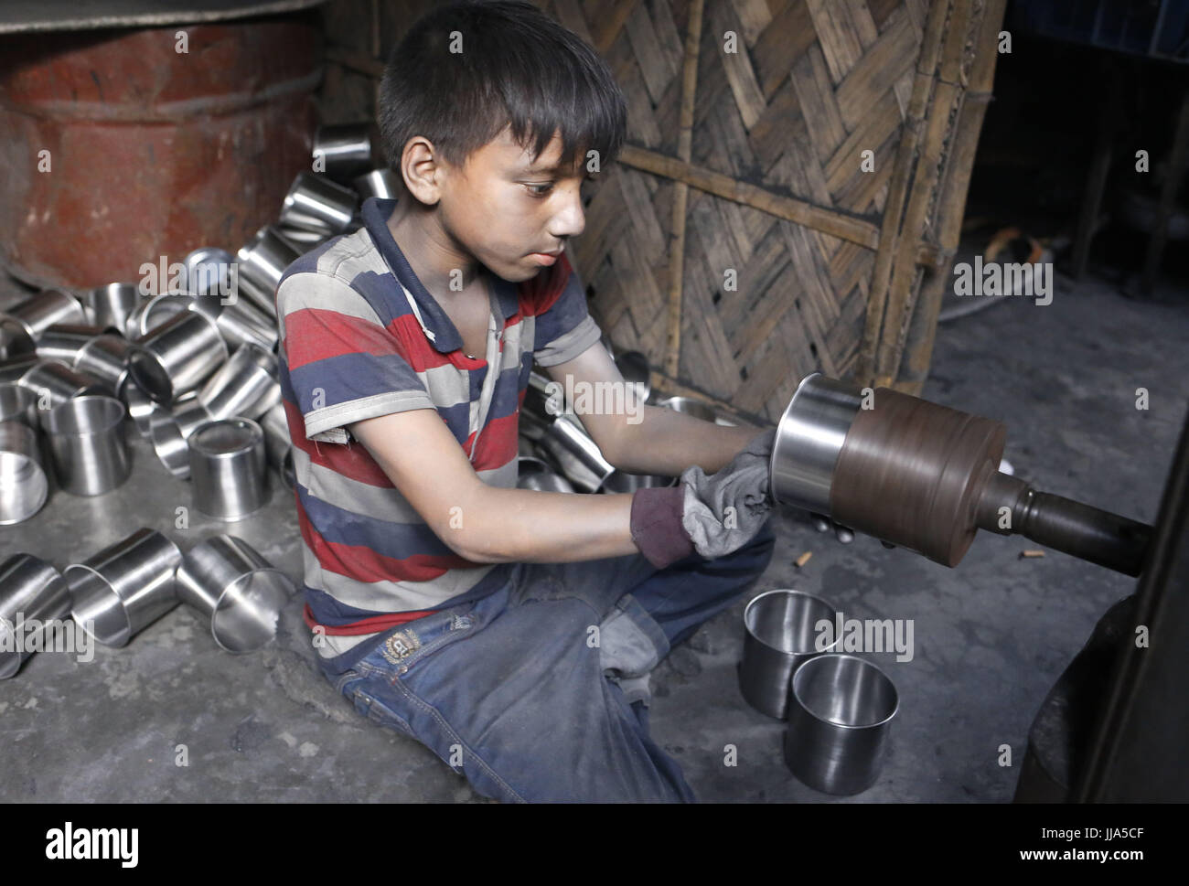 July 18, 2017 - Dhaka, Bangladesh - Mozammel (14), a child labor works ...