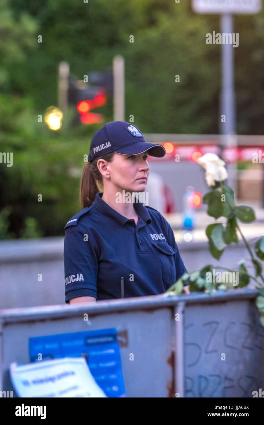 Warsaw, Poland. July 18, 2017. Young female Police officer standing in ...