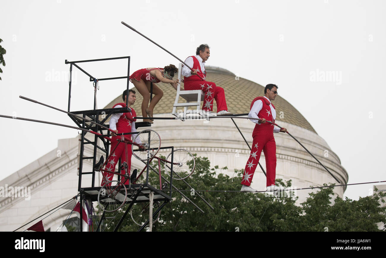 The Wallenda Family Troupe performs on the high-wire in front of the ...