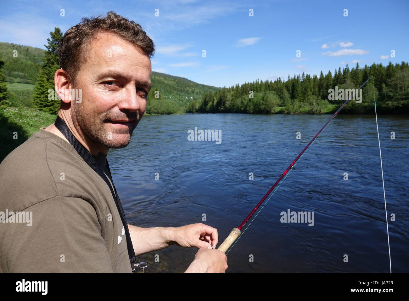 Hitra, Norway. 14th June, 2017. Lodge operator Vegard Heggem attempts ...