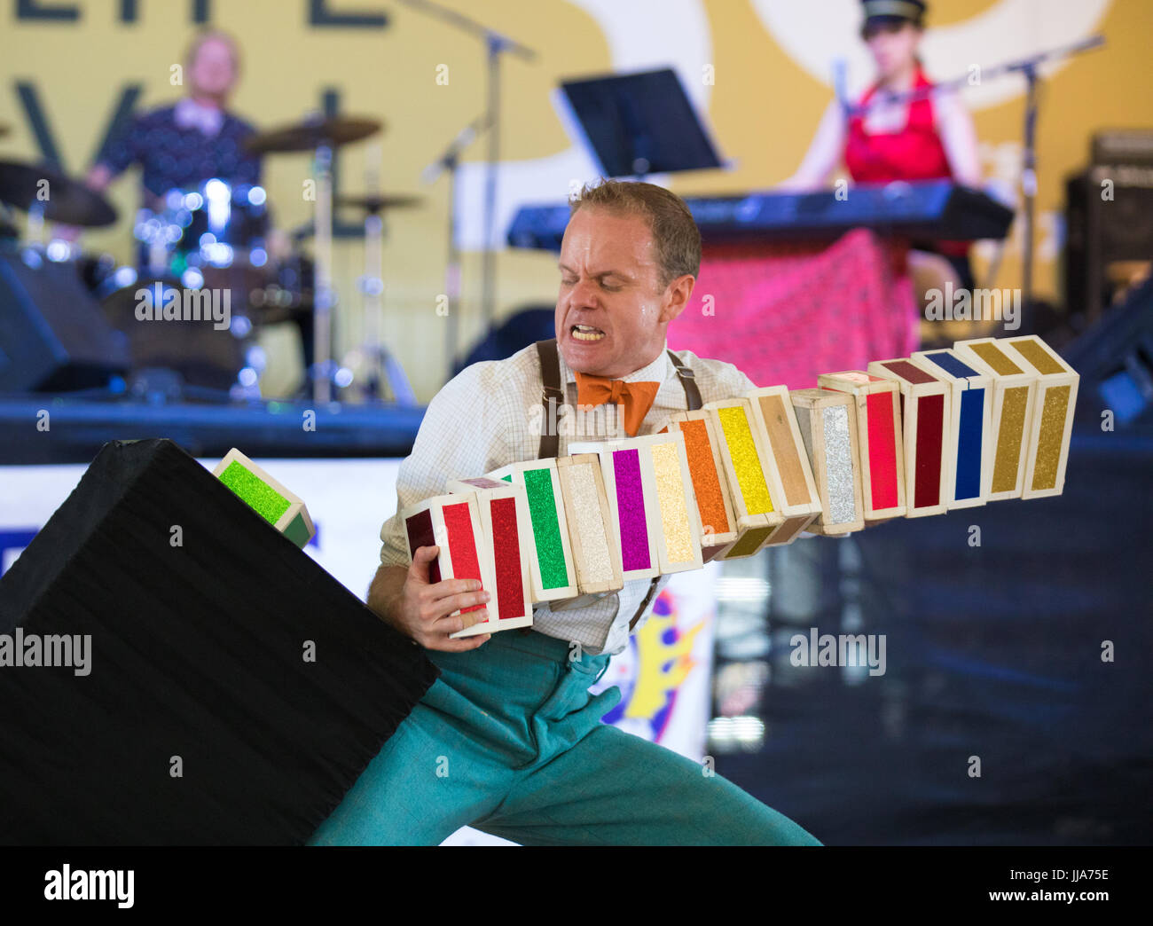 Adam Kuchler juggling and stacking cigar boxes performs for the ...
