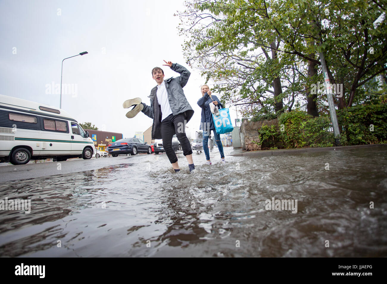 Man walking through flood waters hi-res stock photography and images ...