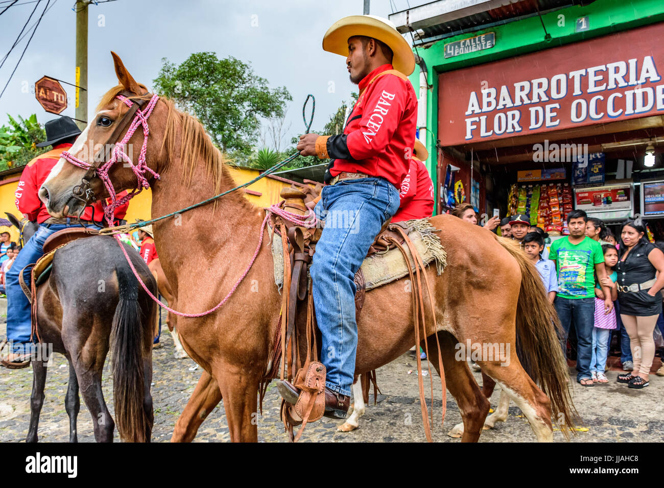San Juan del Obispo, Guatemala - June 12, 2016: Cowboys ride horses in ...