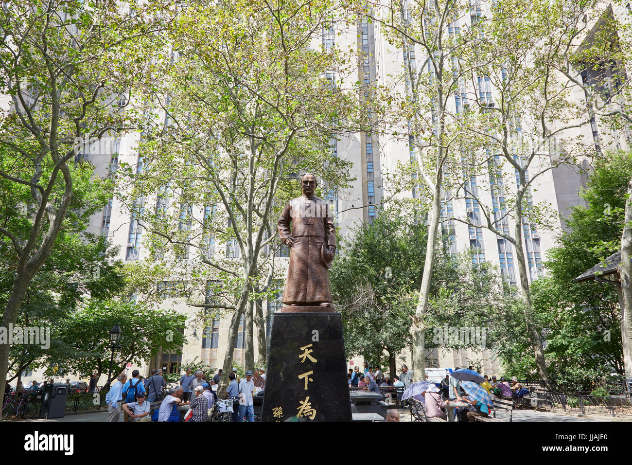 Columbus Park with people playing Chinese Chess and Sen Yat-sen statue ...