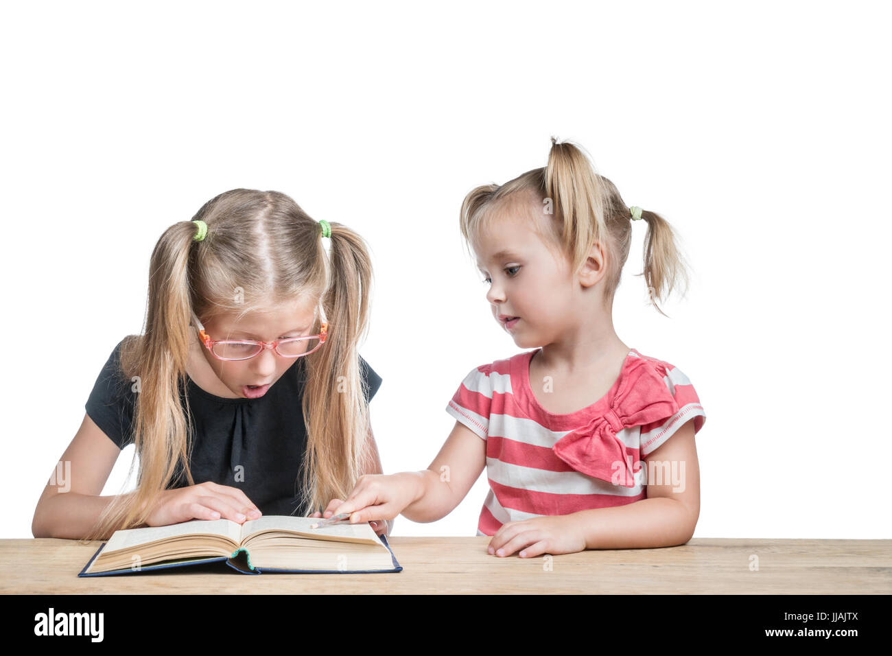 Children study the book Stock Photo - Alamy