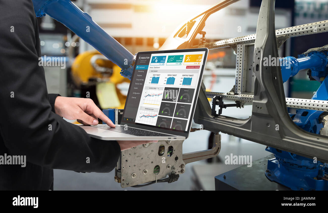 Male manager hand laptop for check real time production monitoring ...