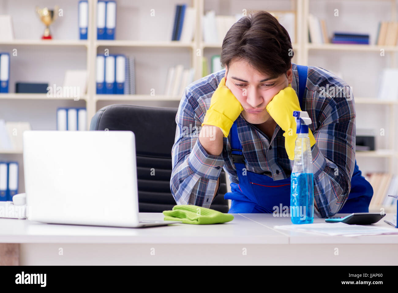 Tired male cleaner mopping hi-res stock photography and images - Alamy