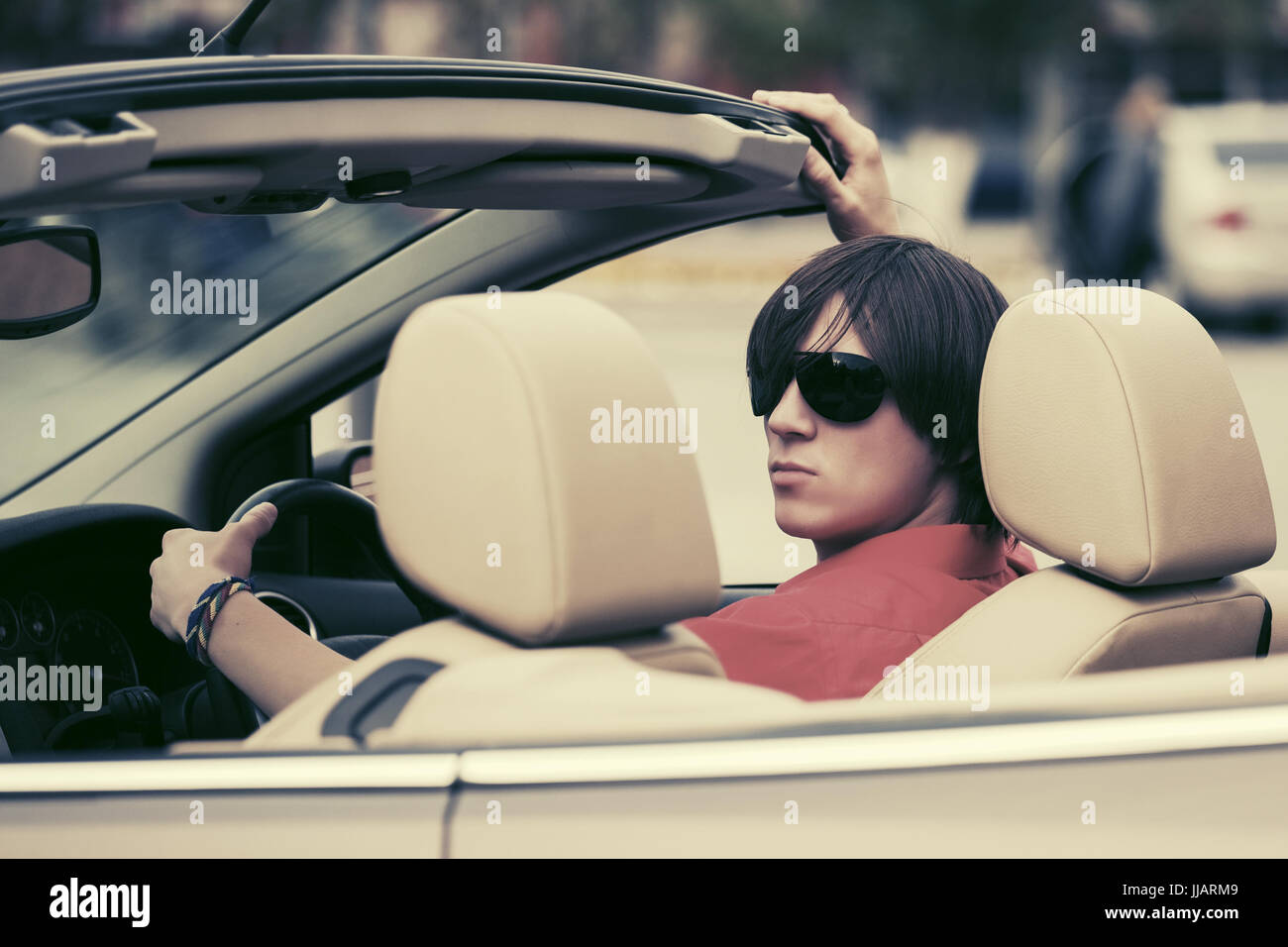 Cool guy driving convertible car hi-res stock photography and images ...