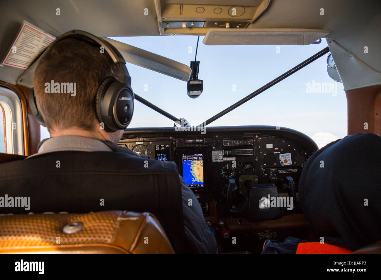Pilot in a Cockpit of a small plane, Alaska, USA Stock Photo - Alamy
