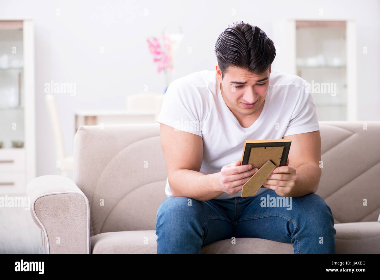 Young man in sad saint valentine concept Stock Photo - Alamy